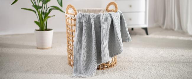 Multiple colors of cotton gauze baby blankets displayed together