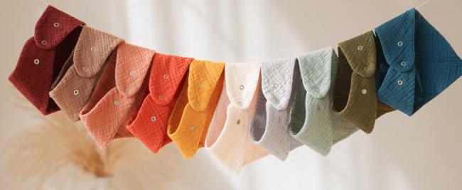 Assortment of neutral colored baby bibs
