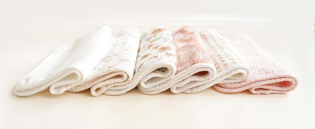 Set of 6 colorful muslin burp cloths neatly folded