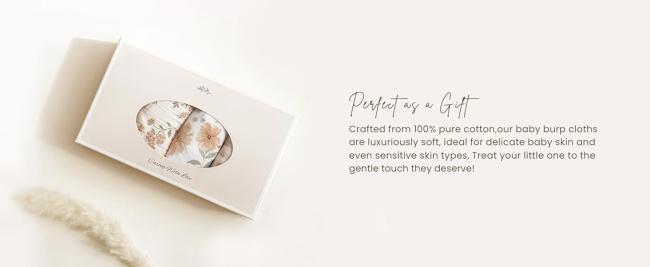 Gift-wrapped set of muslin burp cloths for baby shower