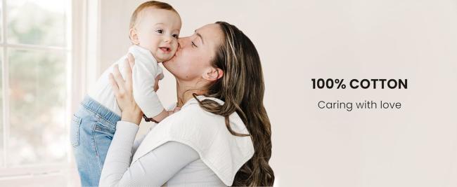 Baby being burped with soft muslin cloth