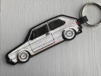 China Custom Embroidered Keychain 100pcs MOQ Polyester Cotton Remove Before Flight Keychain for sale