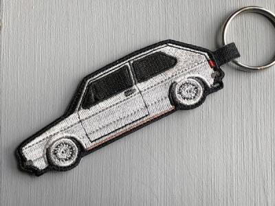 Cina L'automobile su ordinazione Keychains del tessuto della saia del ricamo rimuove prima della catena chiave di volo in vendita