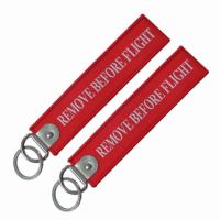 China Custom Polyester Remove Before Flight Keychain 130x30mm with Split Ring and Eyelet for sale