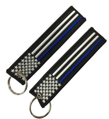 中国 ポリエステルMerrowedのボーダーは味方された刺繍の生地Keytagを倍増する 販売のため