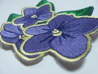 China Custom Embroidered Flower Patch Polyester Background 10C Color Uniform Iron On Patch Heat Cut Border for sale