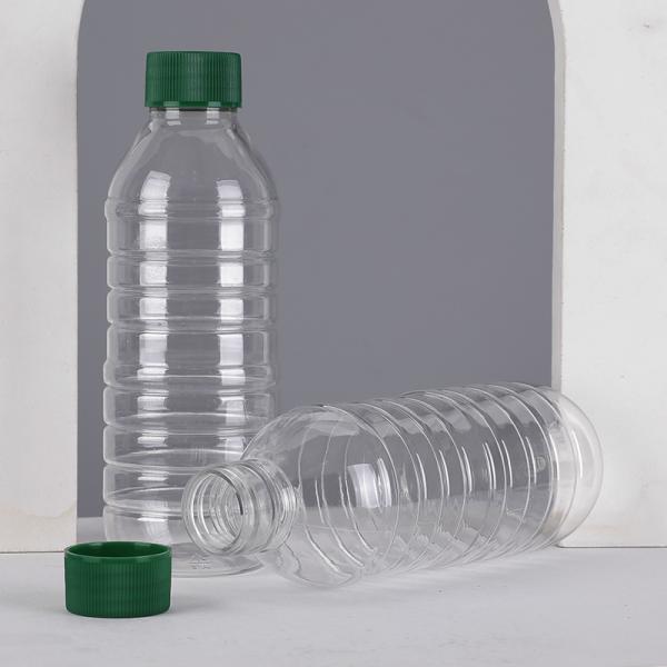 Quality Custom 300ml  Empty Transparent Round Juice PET Plastic Drinking Bottles Spring Water Beverage Container with Lids for sale