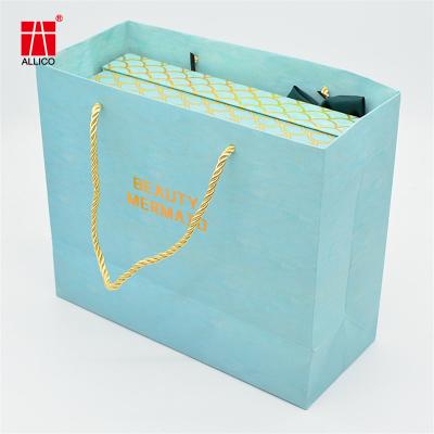 Cina Progetti la borsa per il cliente d'imballaggio di compera dei gioielli della maniglia del nastro dell'abbigliamento cosmetico blu del regalo in vendita