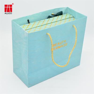 Cina Progetti la borsa per il cliente d'imballaggio di compera dei gioielli della maniglia del nastro dell'abbigliamento cosmetico blu del regalo in vendita