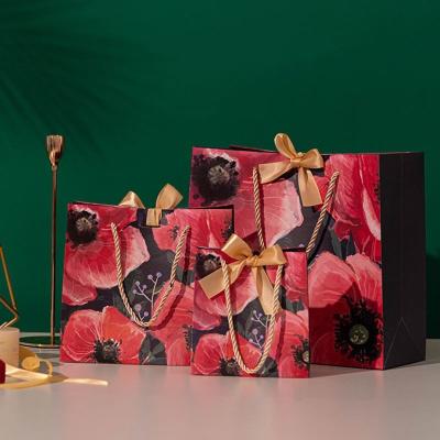 Cina Borsa rossa di Art Paper Printed Paper Shopping con la maniglia del nastro in vendita