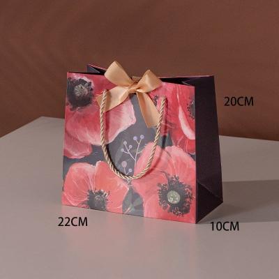 Cina Borsa rossa di Art Paper Printed Paper Shopping con la maniglia del nastro in vendita