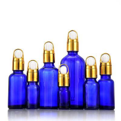 China Frosted Blue Glass Cosmetic Face Serum Bottles Custom Empty Luxury Hair Essential Oil Dropper Bottle with Box Sample Free for sale