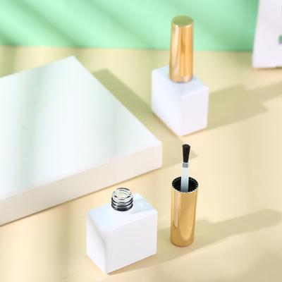 China OEM Custom Logo Design Unique Square White Color Uv Gel Containers Glass Empty Nail Polish Bottles with Brush Chrome Golden Cap for sale
