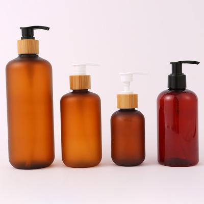 China 300ml 500ml Biodegradable Bamboo Cap Amber Matt Black PET Bottle for in Other Cosmetic Body Wash Shampoo Hair Conditioner for sale