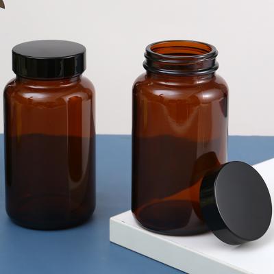 China 8oz 16oz 250ml 300ml 400ml 500ml Amber Brown Pharmaceutical Boston Round Glass Capsule Bottle with Black Cap and Induction Liner for sale