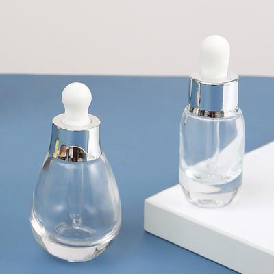 China 15ml 30ml 50ml Mini Luxury Unique Water Drop Shape Essential Hair Oil Dropper Empty Glass Bottle with Silver or Gold Dropper for sale