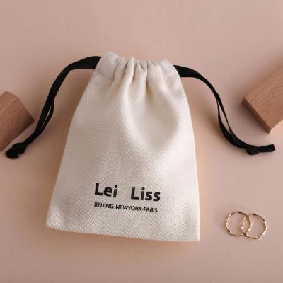 Cina Recyclable Custom Logo Printed Drawstring Cotton Canvas Jewelry Bag Small Gift Jewelry Pouch in vendita