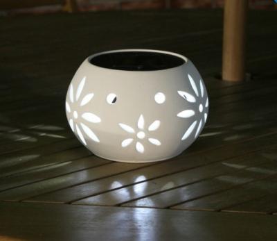 China Solar Powered Ceramic Flower Silhouette Light for garden table for sale