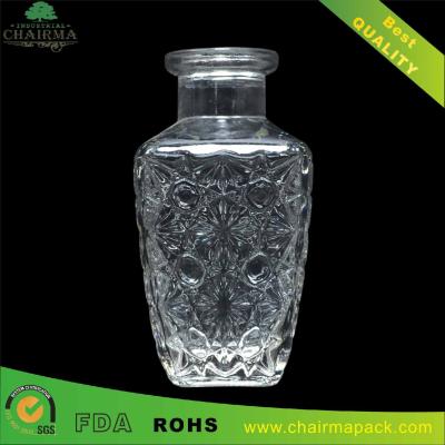 China Tapered with  Edge Embossed Glass Bottle for Whisky for sale