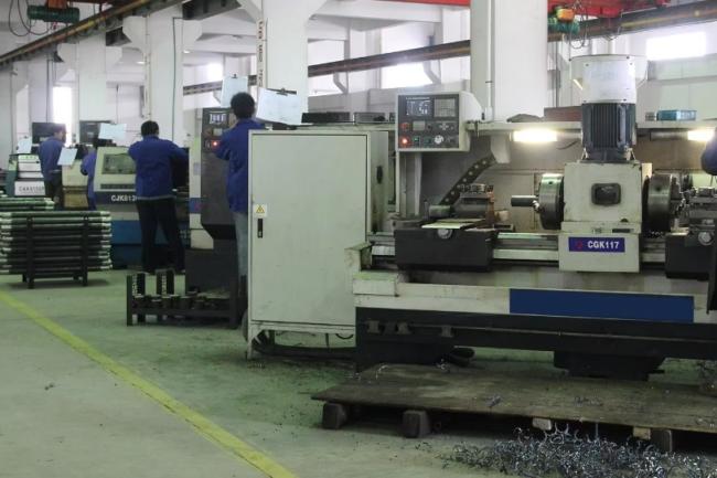 Multiple drill rods arranged for size comparison