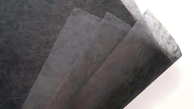 Close-up view of carbon fiber mat texture and structure
