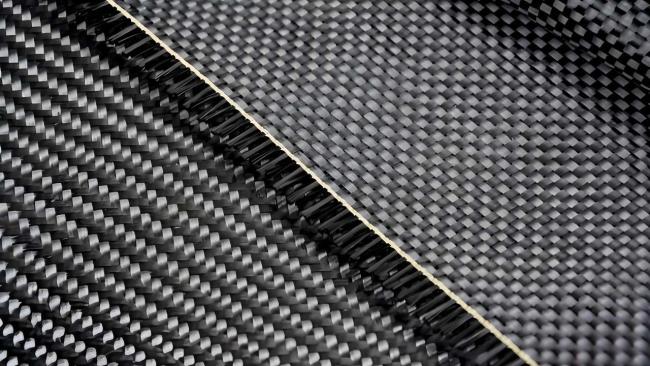 Close-up of Carbon Fiber Plain Weave Fabric texture