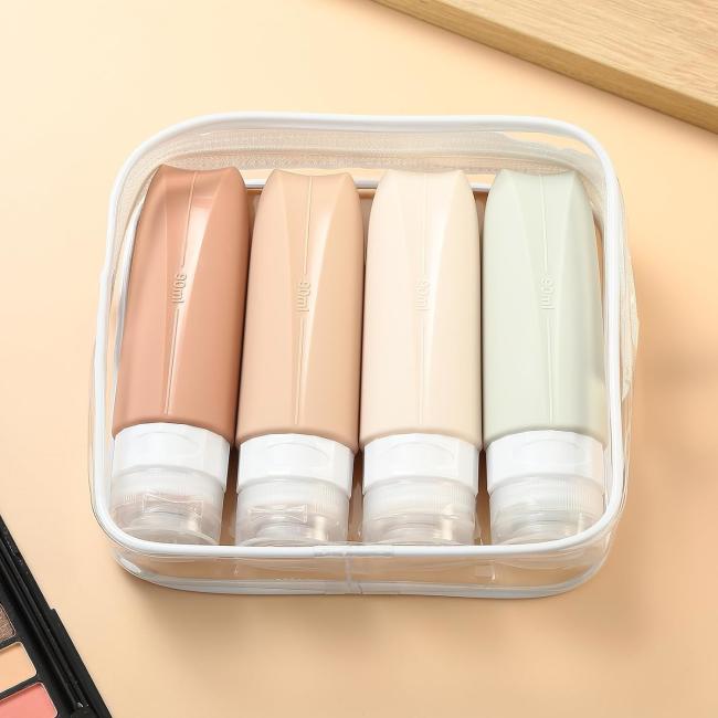 Refillable silicone travel container set showing multiple bottles