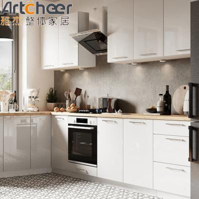 China Modern High Gloss Lacquer L Shape Kitchen Cabinet with Bullnose Edge and Waste Container for sale