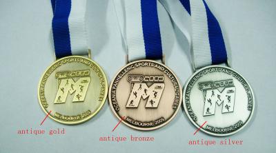 China Manufacturer Wholesale Cheap Antique Plated Souvenir Award Medals And Trophies Custom Gold Sports Medals with Ribbons for sale