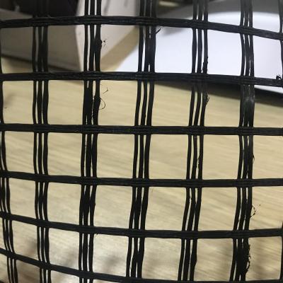 China Bitumen Coated Fiberglass Geogrid Pavement Crack Control Reinforcement Mesh for sale