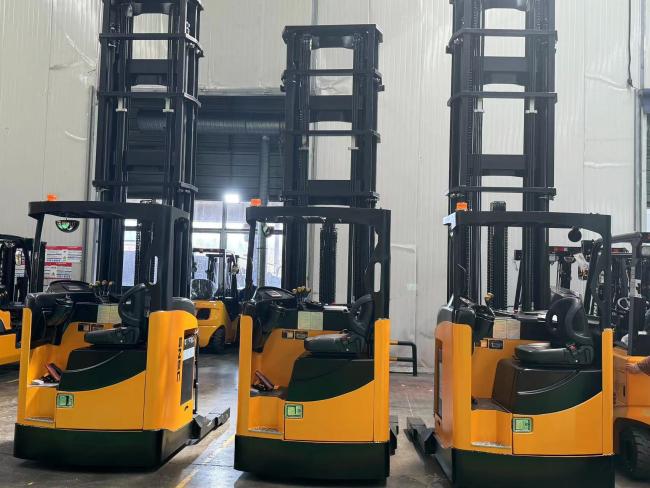 Electric reach truck in warehouse operation