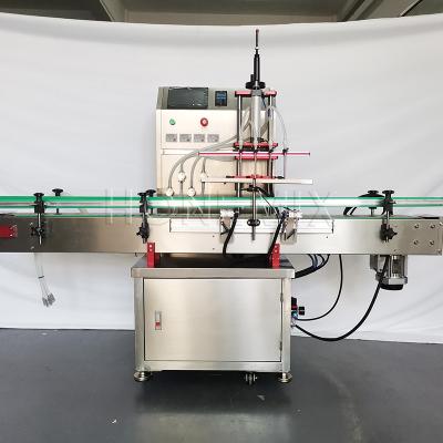 Cina Macchine automatiche di riempimento di liquidi Fabbricante di bottiglie a spruzzo da 1600W 4 teste in vendita