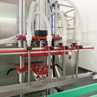 Cina Macchine automatiche di riempimento di liquidi Fabbricante di bottiglie a spruzzo da 1600W 4 teste in vendita