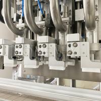 China Four Head Cream Filling Machine Tracking Servo Piston Capping Machine for sale