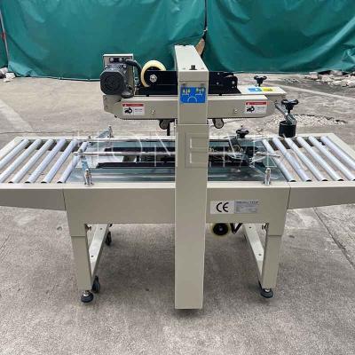 Cina 220V / 50HZ macchina di imballaggio automatico 12mm cartone scatola sigillante adesivo nastro in vendita
