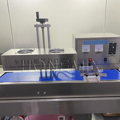 Cina Macchina di sigillamento orizzontale in foglio di alluminio 3 kW per tappi per bottiglie in vendita