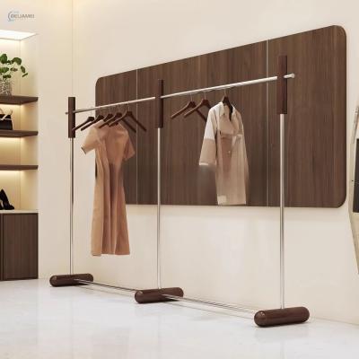 China Women's Floor Hanger Stainless Steel Bright Middle Island Rack Clothing Store Display Shelf for sale