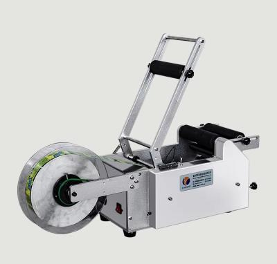 China Semi-Auto Small Desktop Labeling Machine Manual Round Bottle Labeling for Glass Plastic Bottles for sale