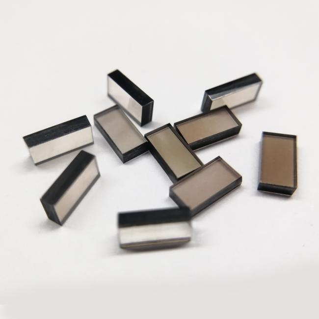 Mono Crystal CVD diamond sample showing rectangular shape and brownish color