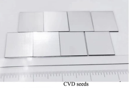 Multiple CVD diamond seeds arranged for size comparison