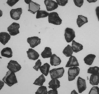 Close-up view of black boron-doped diamond electrodes showing irregular shape