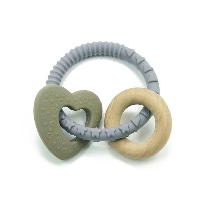 Cina Braccialetto sensoriale di legno di masticazione di Teether del silicone naturale infantile di Montessori in vendita