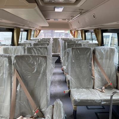 Cina Autobus Rhd Toyo ta Coaster con motore a turbocompressore e prestazioni in vendita
