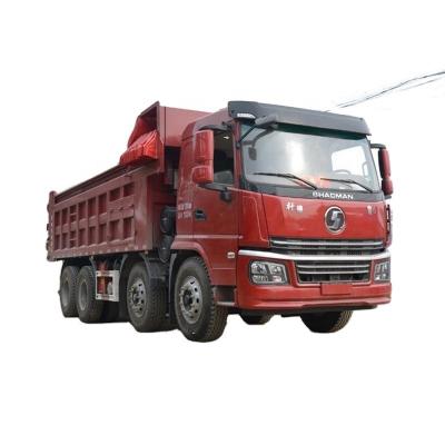 Cina Shacman 8x4 12 ruote 8m3 24 metri cubi 30T bianca pesante usato camion di scarico in buone condizioni in vendita