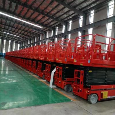 China Electric Self Propelled Scissor Lift Red Scissor Lifter Platform 10m 12m for sale