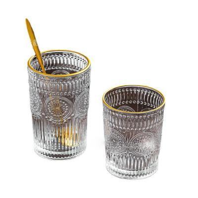 Cina OEM Creativo Retro Sunflower in rilievo Whisky Succo di latte Tumbler Coppa d'acqua in vetro resistente al calore in vendita