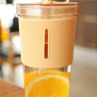 China Double Wall Plastic Reusable Bubble Tea Cup 700ml with Silicone Sleeve for sale