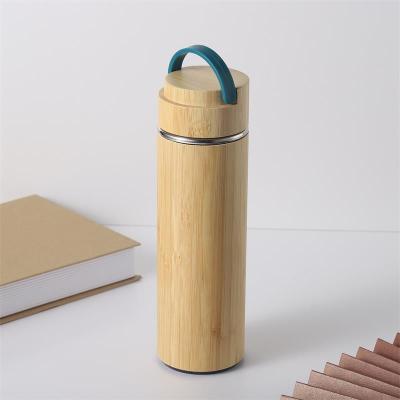 China Eco-friendly Bamboo Handle Stainless Steel Vacuum Insulated Tea Bottle for Outdoor Sports for sale