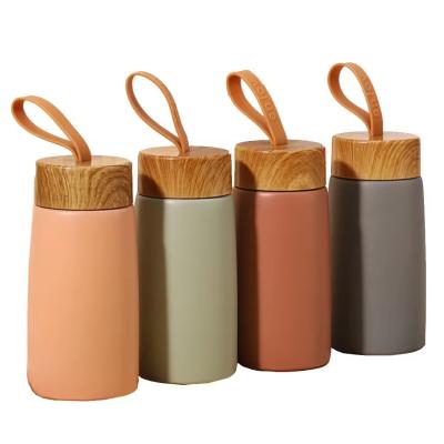 China Vacuo 304 aço inoxidável garrafas de água isoladas 280ml portátil grãos de madeira criativos à venda
