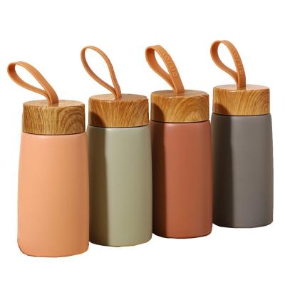 China Amostra 280ML Copo de aço inoxidável de grãos de madeira para logotipo personalizado garrafa de água esportiva para crianças à venda